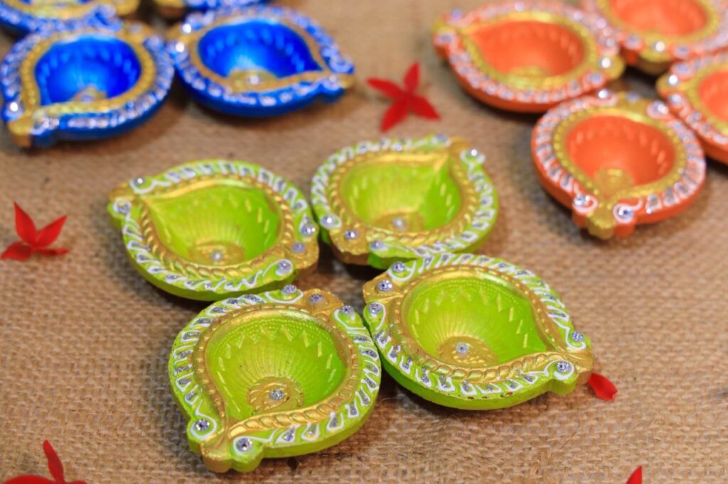 Diwakaram Artistic Clay Diya Collection | Set of 12 | Orange | Blue ...