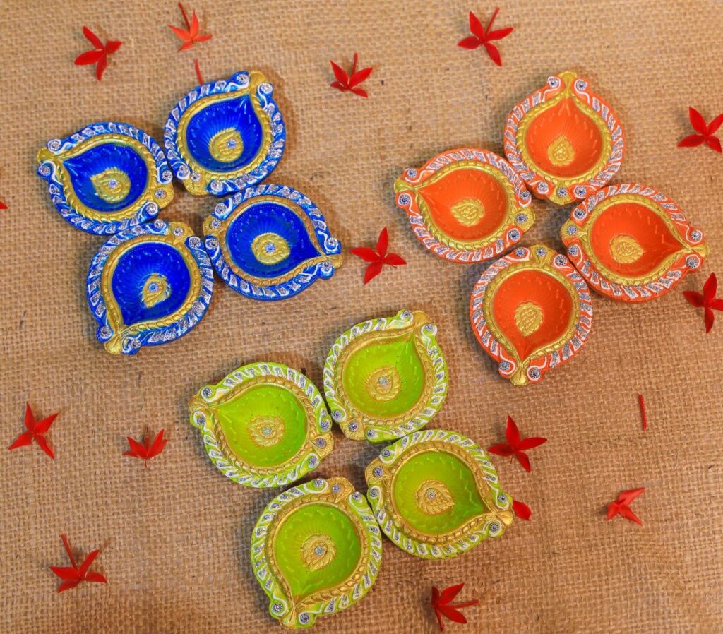 Diwakaram Artistic Clay Diya Collection | Set of 12 | Orange | Blue ...